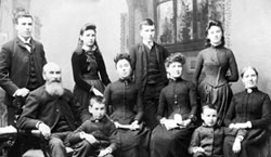 Fraser family portrait, 1889. Monsignor Fraser is seated beside his ...
